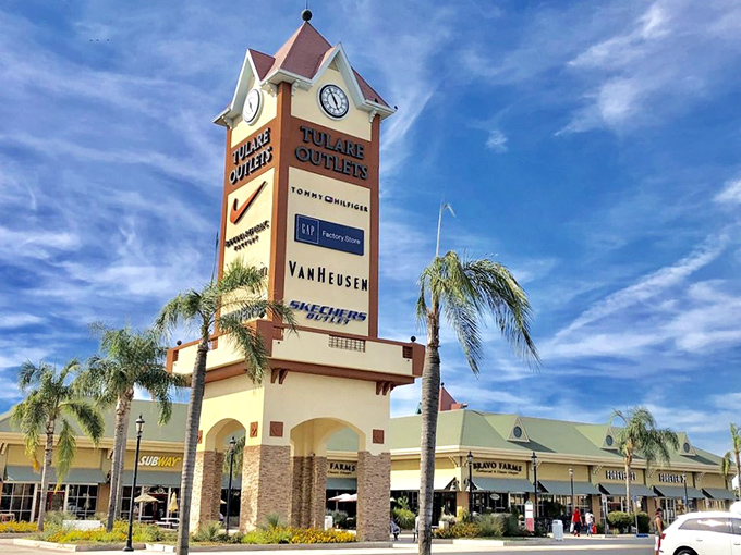 The iconic Tulare Outlets tower against a perfect California sky&mdash;a beacon of hope for fashionistas with champagne taste and beer budgets.