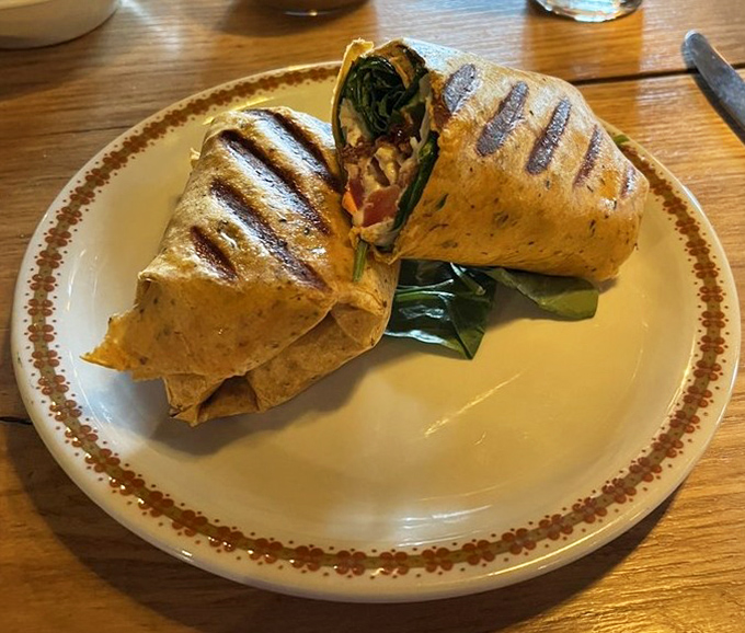 This grilled wrap, cut to reveal its colorful interior, proves that Payne's can nail the classics while still offering fresh, lighter options.