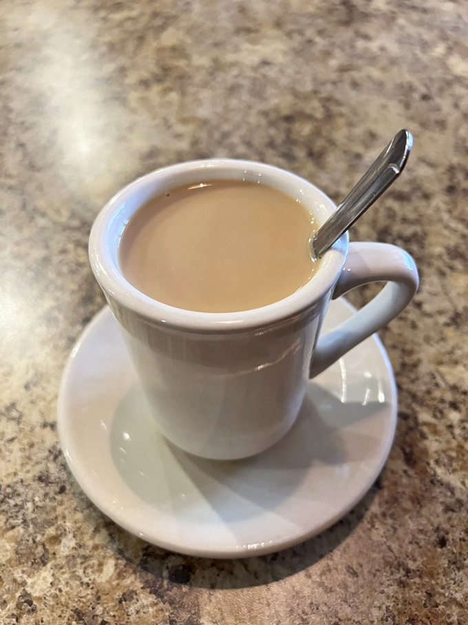 That first sip of diner coffee &ndash; hot, strong, and reliable. It's not fancy, doesn't have an Italian name, but it gets the job done like a trusted friend.
