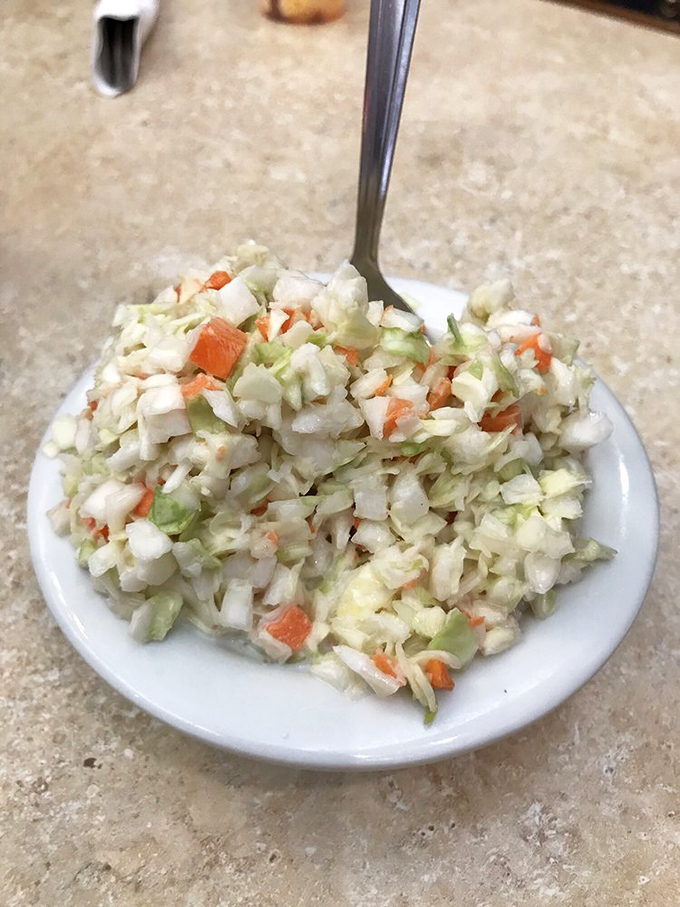 This isn't just coleslaw—it's a crisp, fresh side dish made with the kind of care that elevates even the simplest items on Theo's menu.