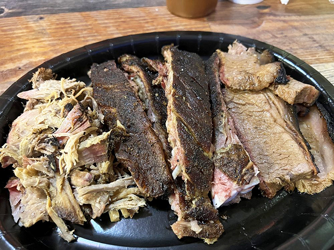 The barbecue sampler plate &ndash; nature's perfect way of saying "Why choose one meat when you can have them all?" Smoke diversity at its finest.