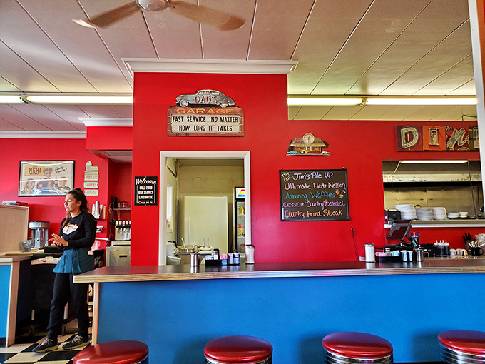 The counter view&mdash;where solo diners find community and regulars exchange local news while watching breakfast magic unfold in the kitchen beyond.