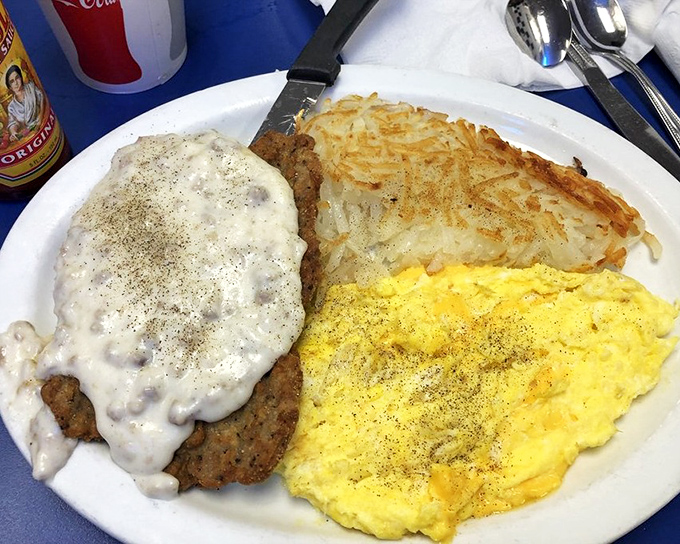 Country fried steak smothered in pepper gravy alongside scrambled eggs and hash browns. The holy trinity of comfort food that hugs you from the inside.
