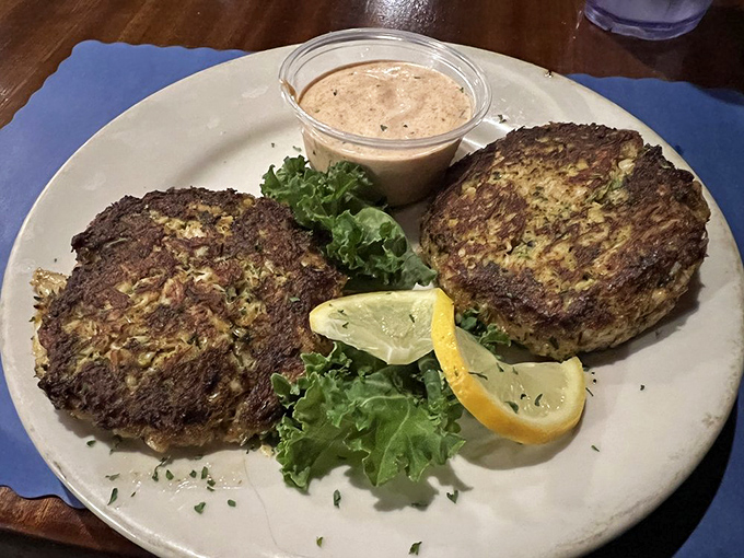 Crab cakes that are actually crab, not breadcrumbs with seafood aspirations. Served with a sauce that deserves its own fan club.