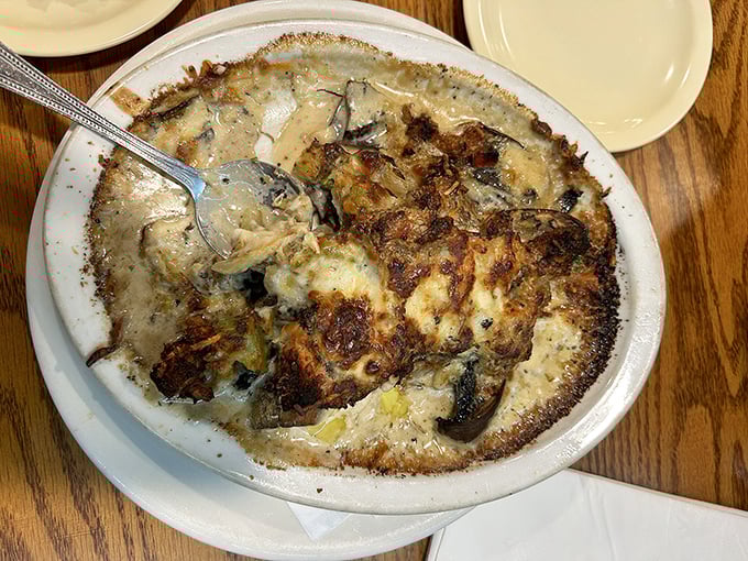 Crab-stuffed mushrooms bubbling with cheese and possibility. The appetizer that makes you question ordering a main course.