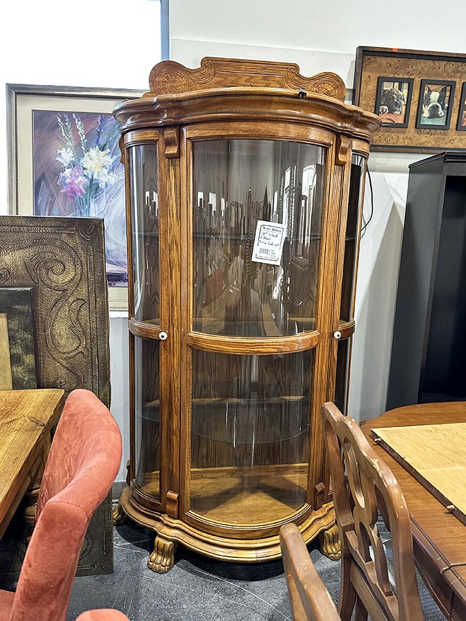 A curved-glass curio cabinet that would make your grandmother swoon. Perfect for displaying collectibles or just looking fancy while holding your snack stash.