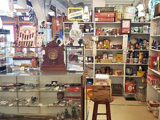 Vintage advertising meets functional art in this corner where Coca-Cola memorabilia and antique timepieces remind us when brands built things to last.