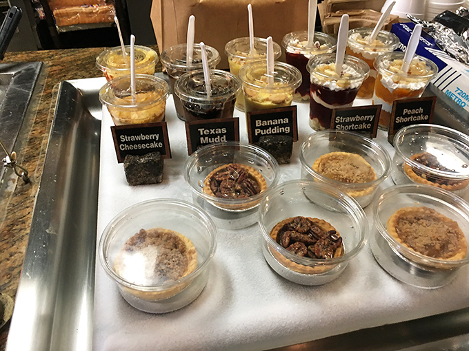 Desserts in cups lined up like sweet soldiers, from banana pudding to Texas Mudd, ensuring your meal ends on a high note.