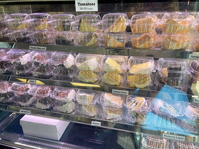 Rows of colorful cake slices await, from chocolate to lemon cr&egrave;me, making it impossible to choose just one.