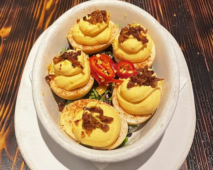 Deviled eggs that have clearly gone to finishing school. Those little crispy bits on top are the culinary equivalent of putting a bow tie on perfection.