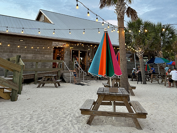 Sandy floors and string lights create the perfect casual dining atmosphere where flip-flops are welcome and seafood arrives fresh from local waters.