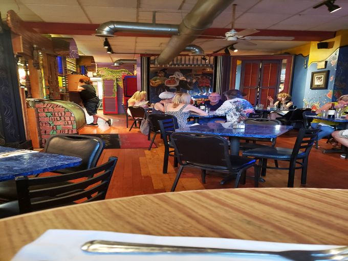 The vibrant dining area buzzes with conversation and clinking glasses&mdash;proof that great seafood creates community, even hundreds of miles from any ocean. 