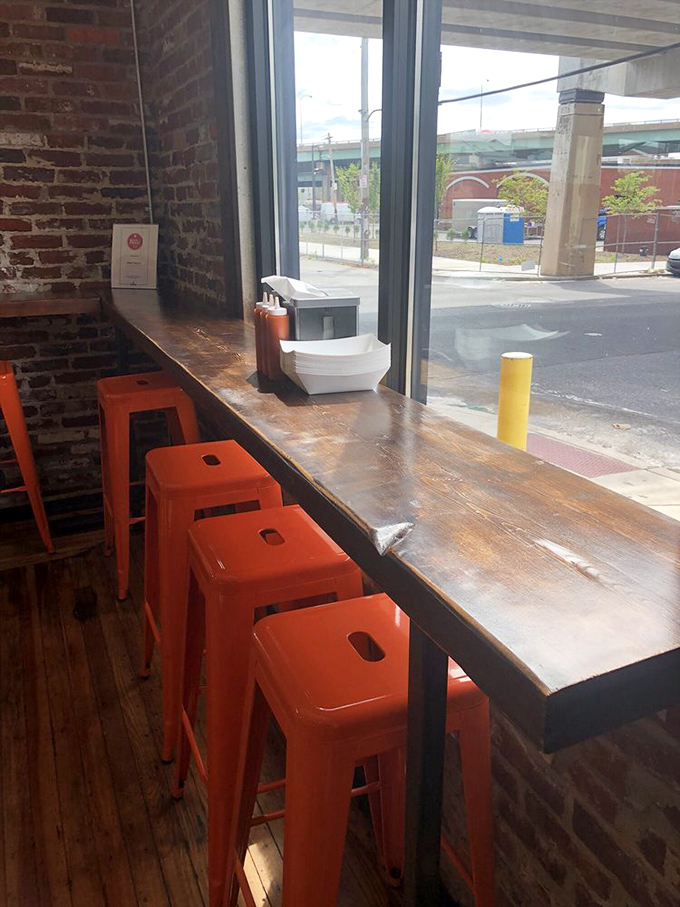 Window seats with bright orange stools&mdash;the perfect perch for people-watching while contemplating whether to order seconds or save room for pie.