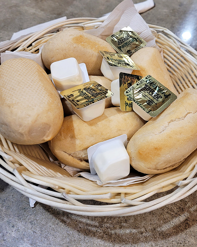 Dinner rolls that arrive like a warm-up act but steal the show. These pillowy delights are why bread baskets were invented.
