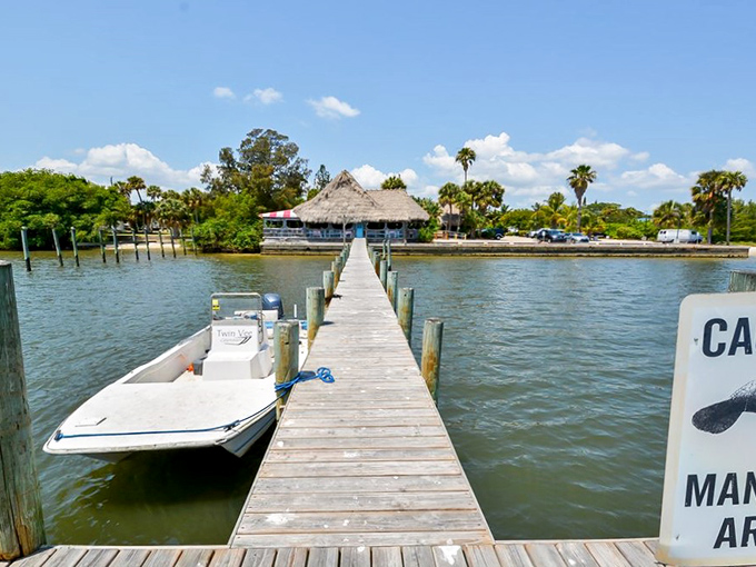 That wooden dock leading to paradise tells you everything: at Conchy Joe's, you can arrive by car or boat, but you'll leave happier either way.