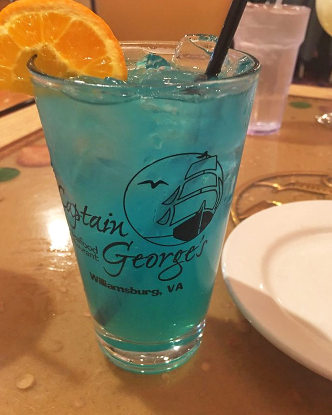 The signature blue drink that matches the ocean theme. It's vacation in a glass, complete with that essential orange slice hat.