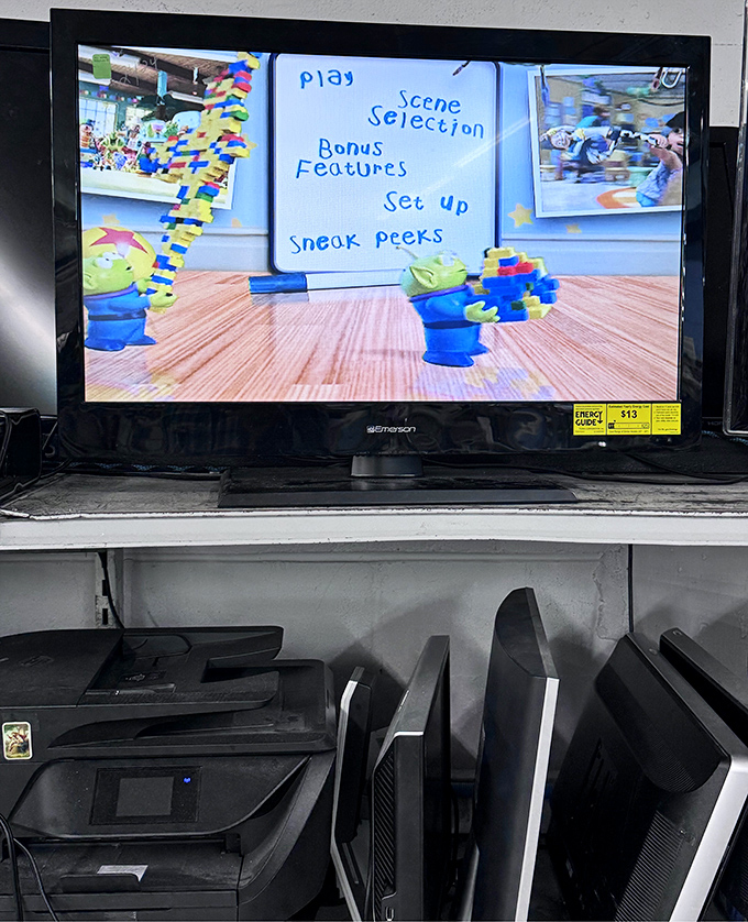 Yesterday's electronics at tomorrow's prices. That DVD menu screen suggests someone's Toy Story collection could become your rainy day entertainment arsenal.