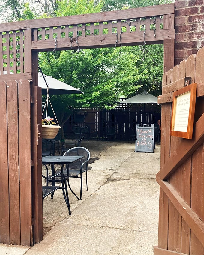 This garden gate entrance isn't just an opening to a patio &ndash; it's a portal to the kind of afternoon that makes you forget to check your phone.