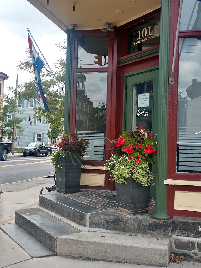 The entrance to Kitchen 101 stands like a portal to flavor country, complete with flower boxes that say "Welcome to deliciousness."