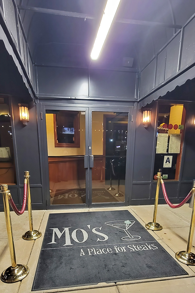 The entrance sets the tone: you're not just walking into a restaurant, you're stepping onto a culinary red carpet. The velvet ropes aren't keeping people out&mdash;they're building anticipation.