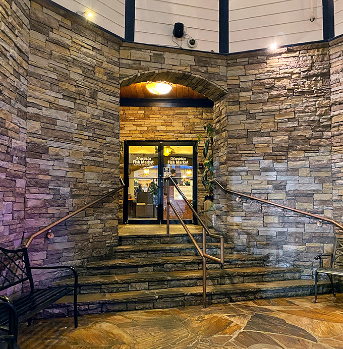 The stone entrance feels like the gateway to a maritime castle, inviting you into a world where seafood reigns supreme.