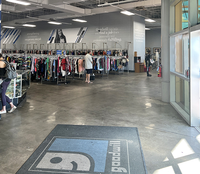 The entrance to thrifting nirvana, where the Goodwill logo promises not just bargains but the warm fuzzy feeling of shopping that actually helps others.