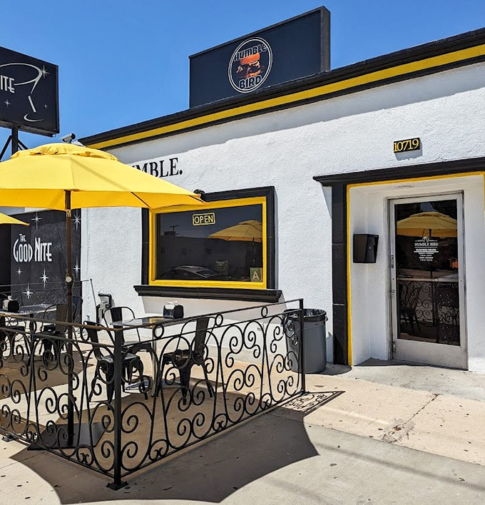 The entrance to chicken paradise&mdash;simple, unassuming, and marked by that signature yellow trim that signals you've arrived somewhere special. 