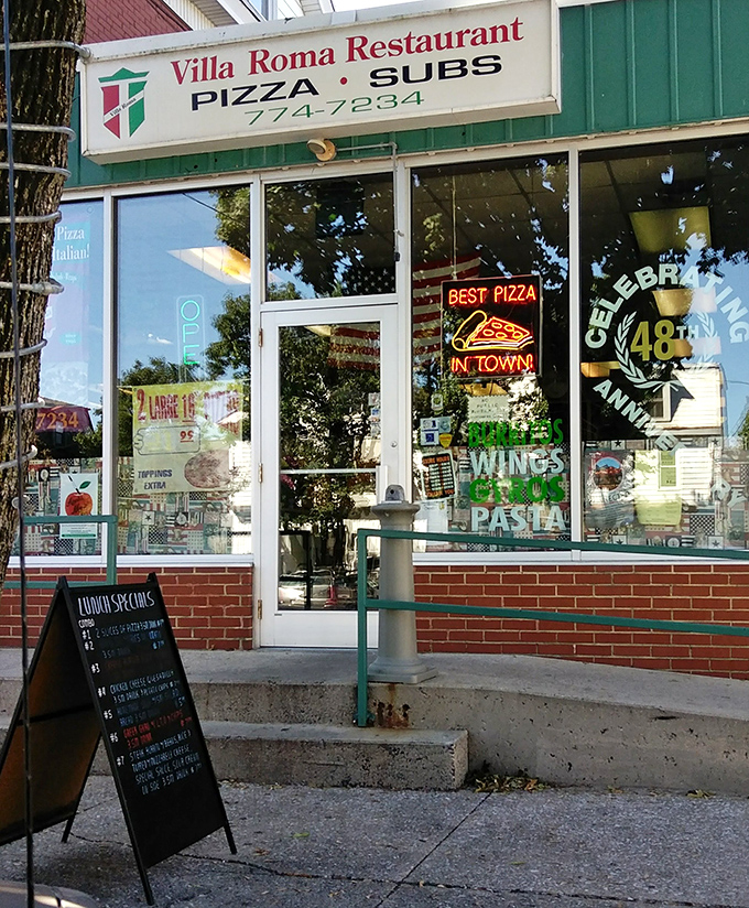 The entrance to paradise isn't pearly gates &ndash; it's a glass door with a neon "OPEN" sign and the promise of perfect pizza within.