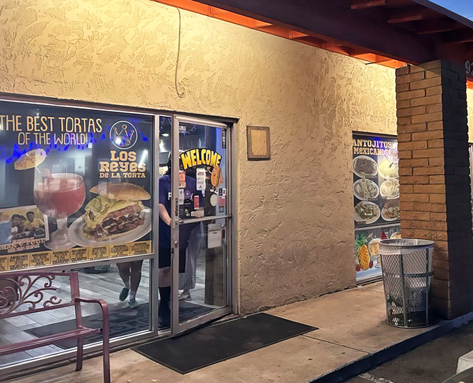 By night, the entrance glows with promise. "The Best Tortas of the World" isn't just a claim – it's a mission statement.