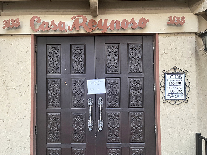 Simple signage announcing hours for a place where timing your visit becomes absolutely essential.