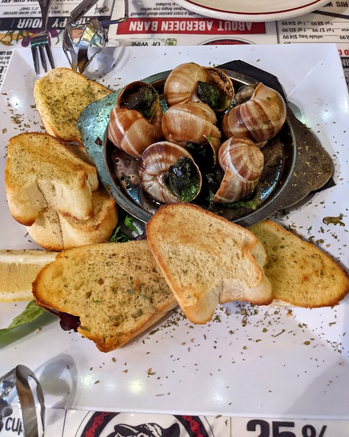 Escargot isn't just a fancy French word&mdash;it's butter-drenched, garlic-infused decadence that makes you wonder why you ever hesitated. The garlic toast isn't just for show&mdash;it's for sopping up that liquid gold.