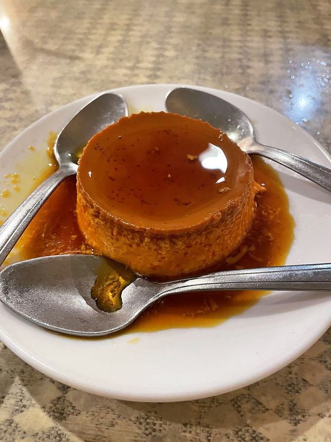 Flan so smooth it makes silk pajamas feel like sandpaper—the perfect sweet finale to a meal worth remembering.