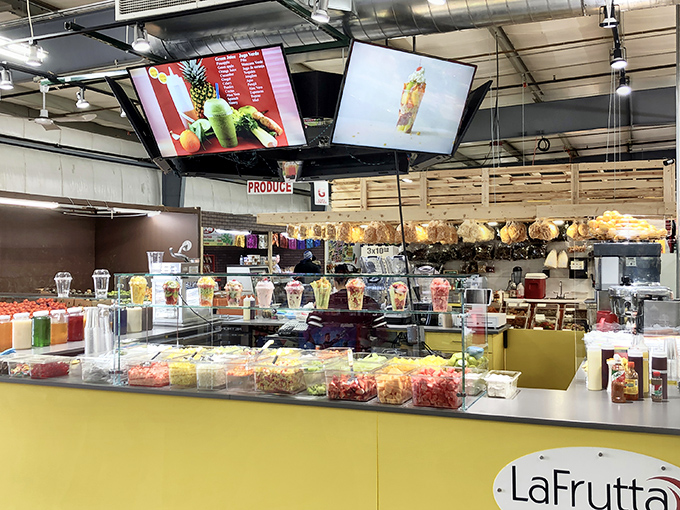 Fresh fruit paradise! This modern juice bar brings a splash of vibrant color and healthy options to shoppers needing refreshment between treasure hunts.