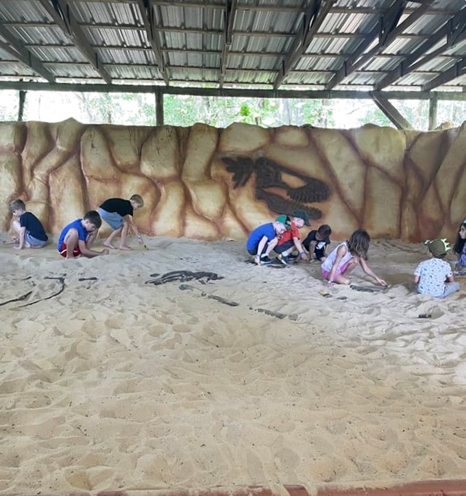 Little paleontologists at work in the fossil dig area. Future scientists unearthing the past while parents enjoy a moment of prehistoric peace.