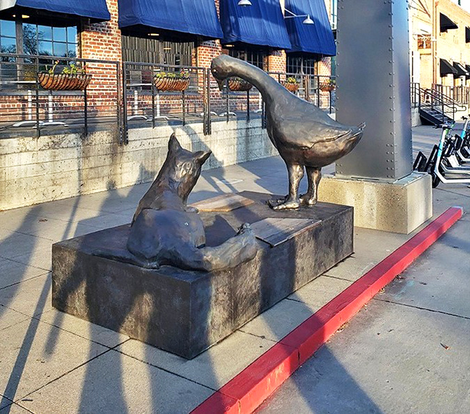 Fox and Goose immortalized in metal &ndash; a whimsical nod to the pub's namesake that stands guard outside like a quirky British sentinel.