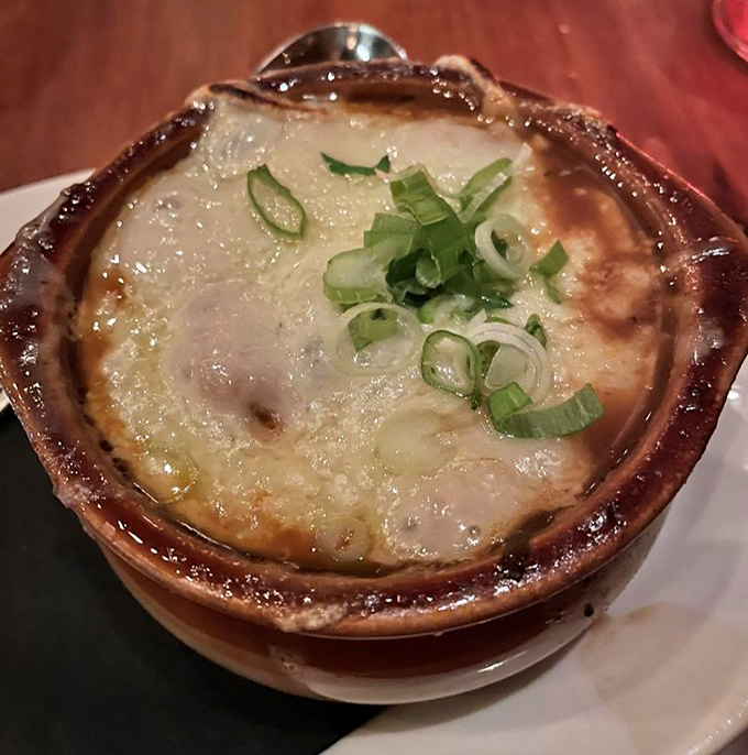 French onion soup that's worth the cheese pull. This bubbling crock of savory broth and gooey Gruy&egrave;re demands a moment of silence.