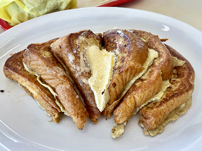 French toast cut into triangles and stacked like delicious dominoes&mdash;breakfast architecture at its most delicious.