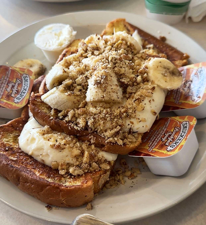 French toast that's dressed for success. Those bananas and crumbled nuts aren't just toppings&mdash;they're the supporting actors in this breakfast blockbuster.