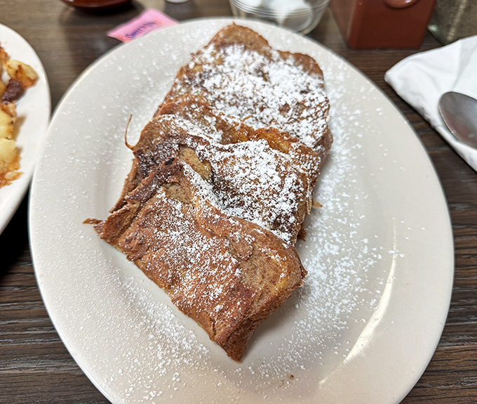 French toast that doesn't need a passport to impress&mdash;just the perfect dusting of powdered sugar and the confidence to let simplicity shine.