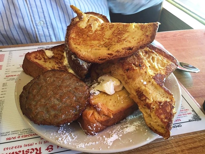 
French toast elevated to an art form, with a supporting cast of breakfast meats. The kind of plate that makes you seriously reconsider your home cooking efforts.