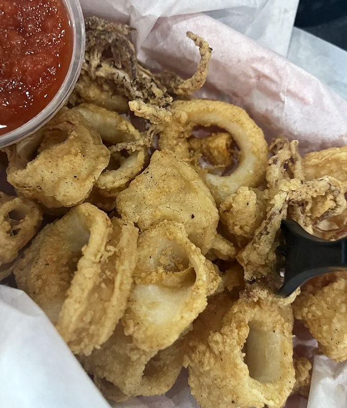 Crispy calamari rings with marinara &ndash; proof that Dog House Grill knows its way around the fryer too.