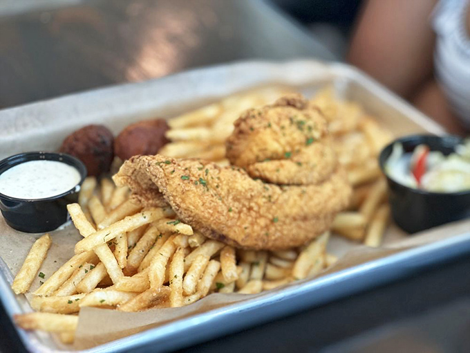 Golden-fried perfection meets French fry abundance&mdash;proof that sometimes the simplest preparations create the most satisfying bites.