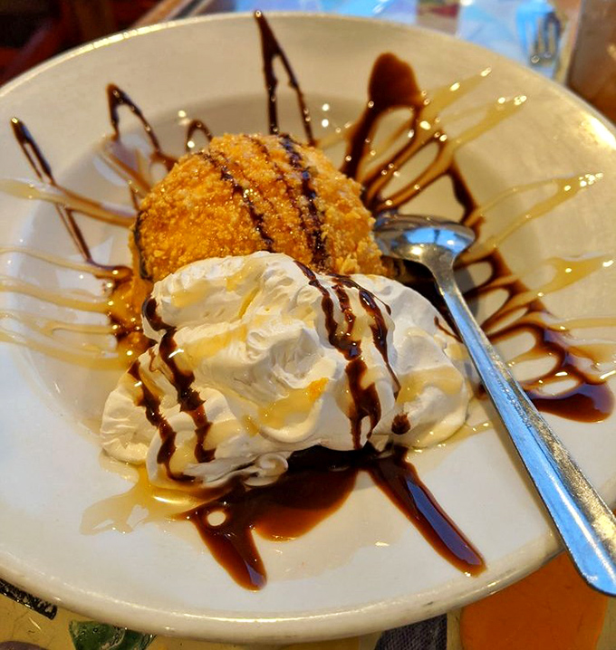 Fried ice cream that makes you question physics. How is it warm AND cold? It's like dessert magic on a plate.