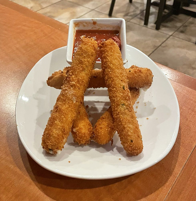 Mozzarella sticks that have achieved the golden-brown perfection we all aspire to in life. That marinara dip is standing by for its supporting role.