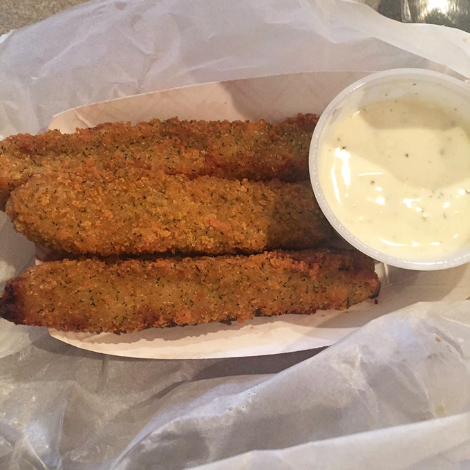Fried pickles&mdash;tangy, crunchy spears of joy that make you wonder why we ever ate pickles any other way. That dipping sauce? Chef's kiss.