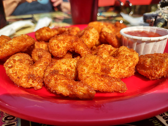These crispy golden shrimp aren't just appetizers &ndash; they're little crescents of joy that disappear from plates faster than you can say "just one more."