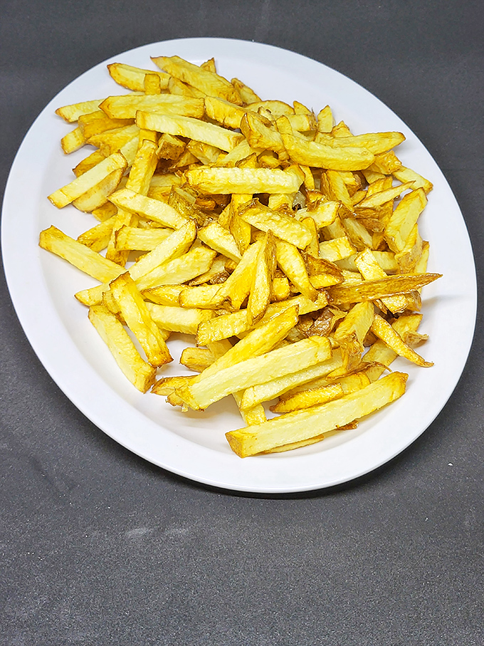 Fries cut by hand and cooked to golden perfection—not some frozen, mass-produced afterthought. These potatoes died for a noble cause.