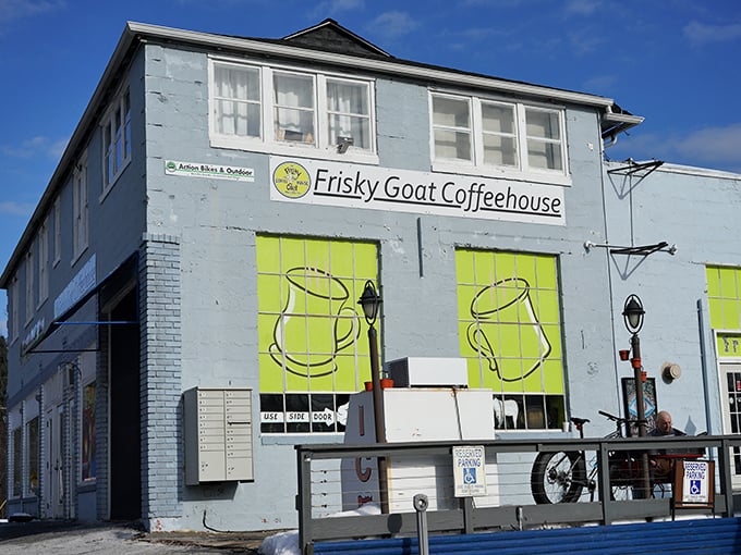 The Frisky Goat Coffeehouse's bright blue exterior and lime green accents promise a caffeine experience that's anything but sleepy. Coffee with personality!