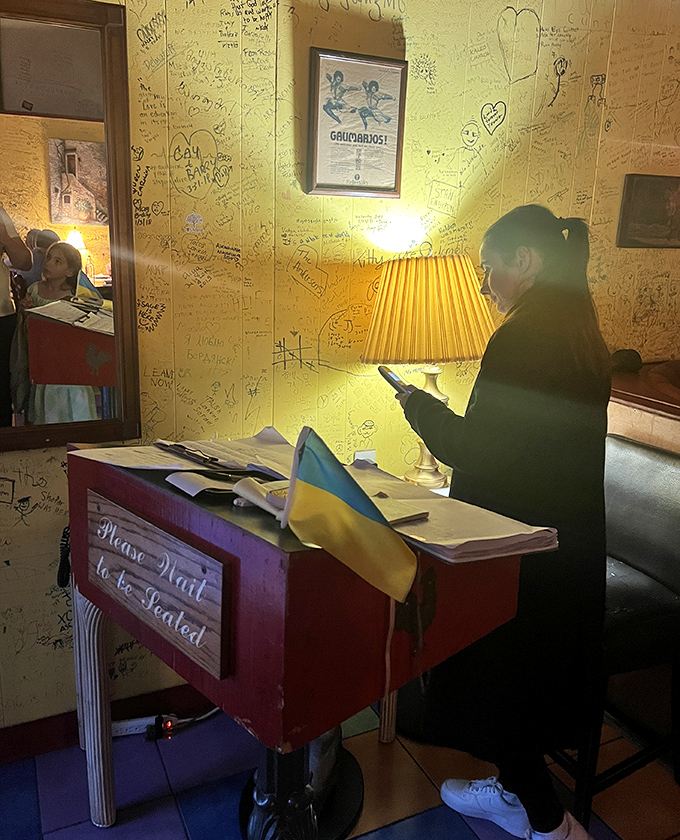 The walls covered in guest signatures speak volumes – this isn't just a place to eat, but a destination worthy of leaving your mark.