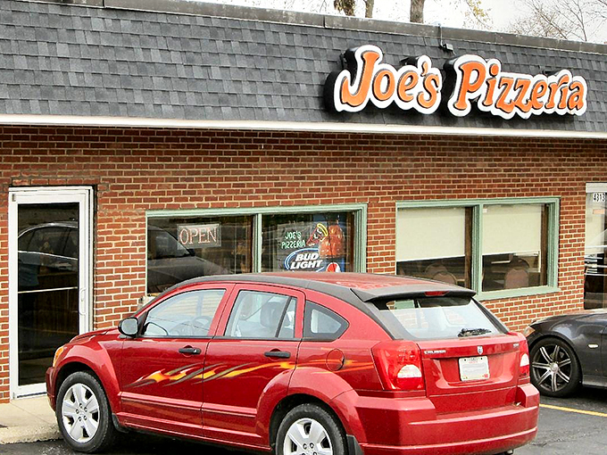 The front view reveals what locals already know&mdash;this unassuming brick building houses pizza treasures worth their weight in gold and cheese. 